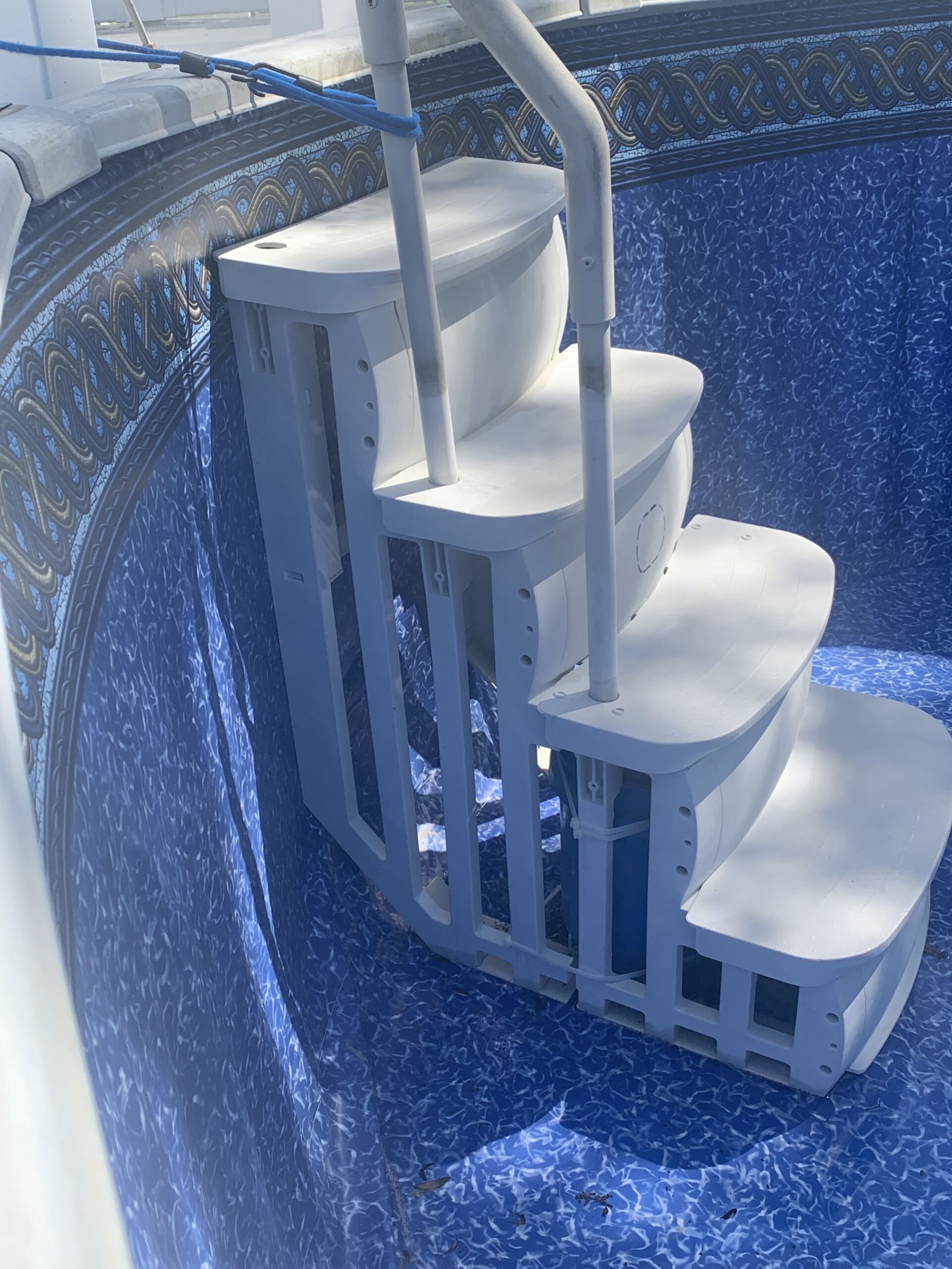 Most pool packages come with just an A-frame ladder to get in and out ...