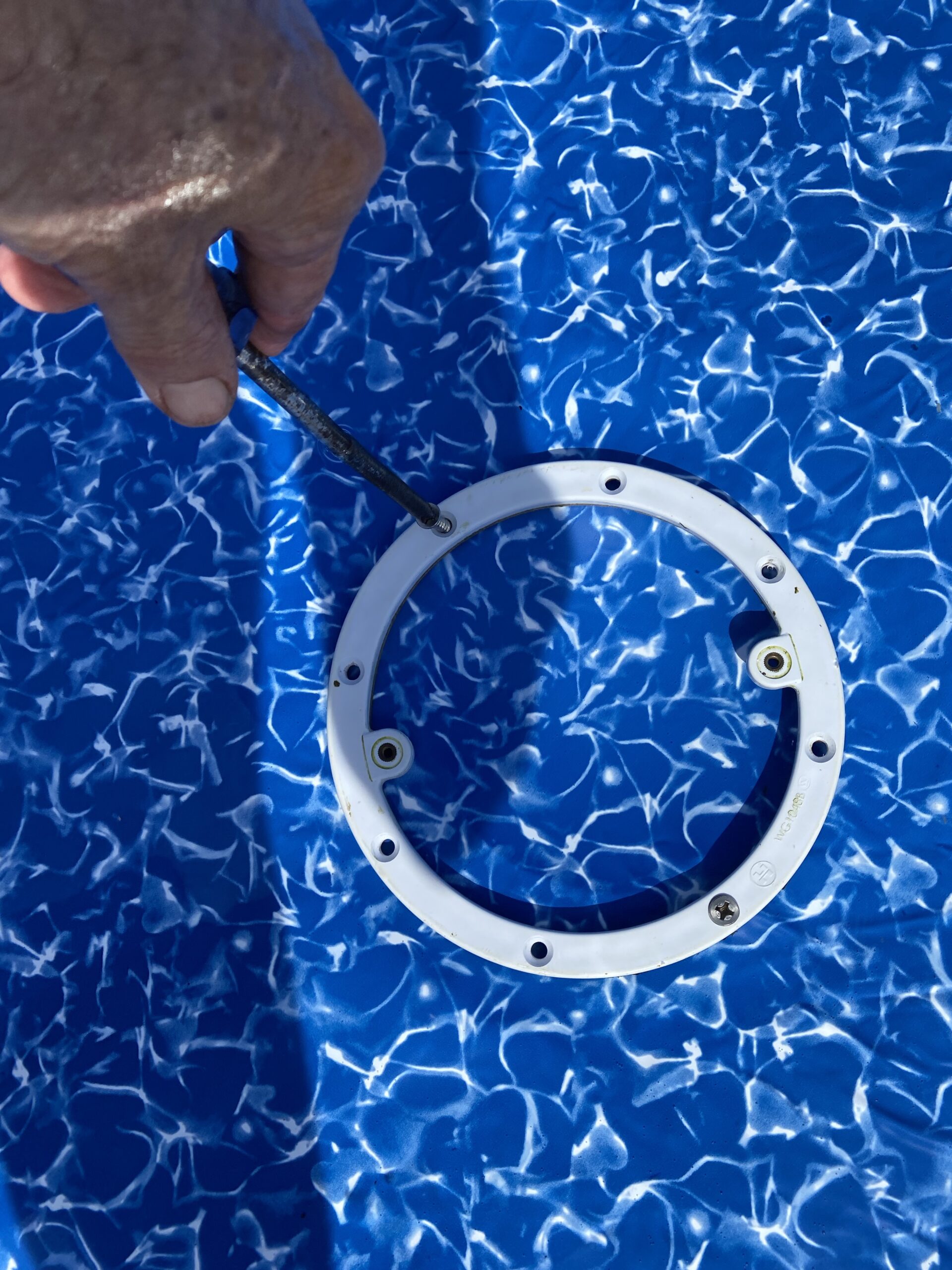 12 After water is added to the pool and the liner stretched in place ...
